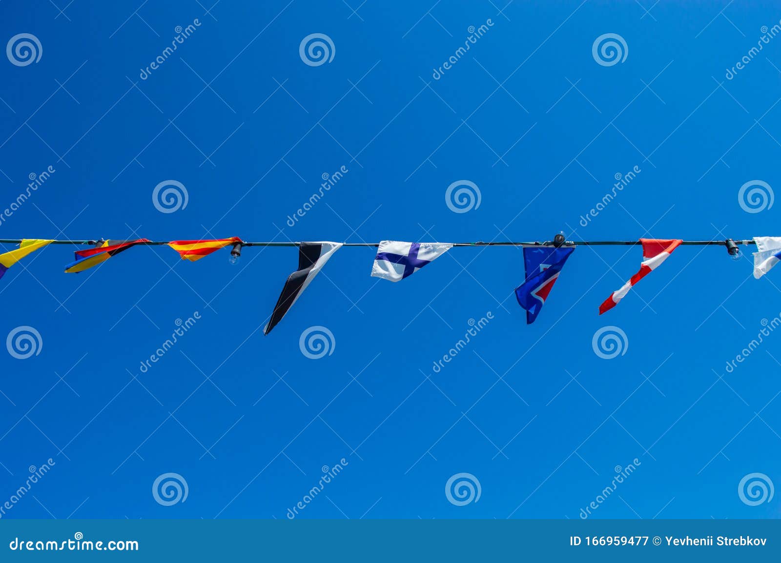 Rope with the Flags of Different Countries on a Background of Blue Sky ...