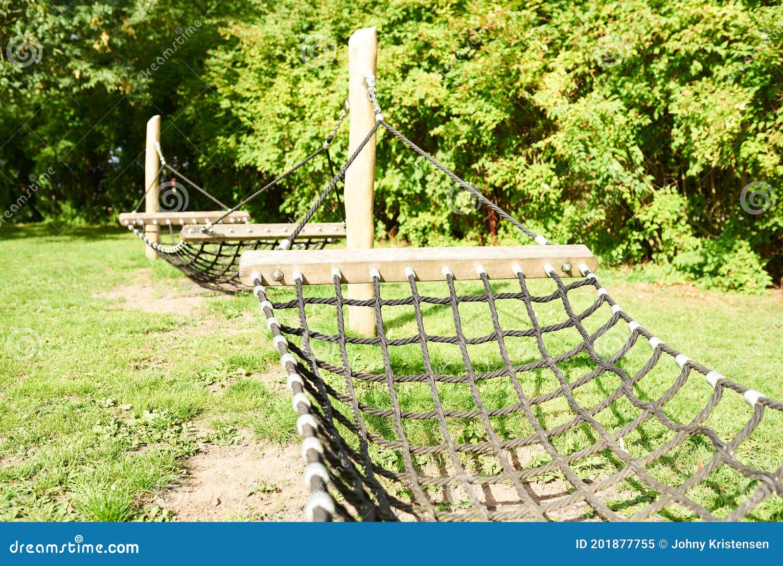 A Rope Hammock Hanging on a Pole in a Backyard Stock Image - Image of ...