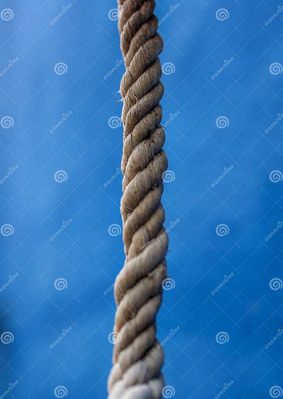 A hanging white rope stock image. Image of winding, nautical - 163460263