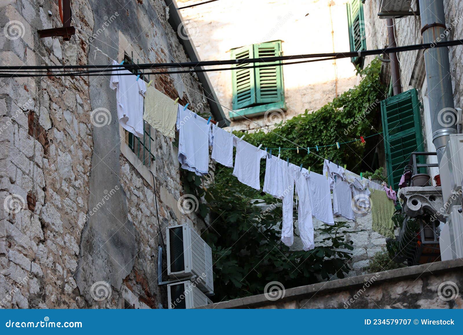 Rope between Houses with Laundry Hanging on it Stock Image - Image of ...
