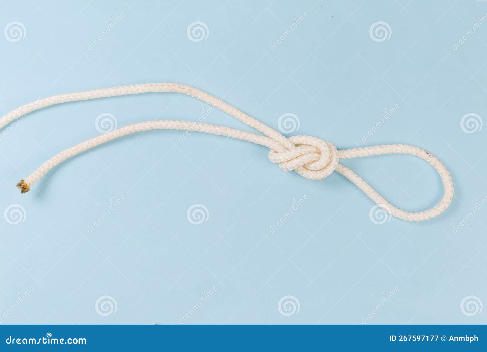 Rope Knot As Overhand Loop on a Blue Background Stock Image - Image of ...
