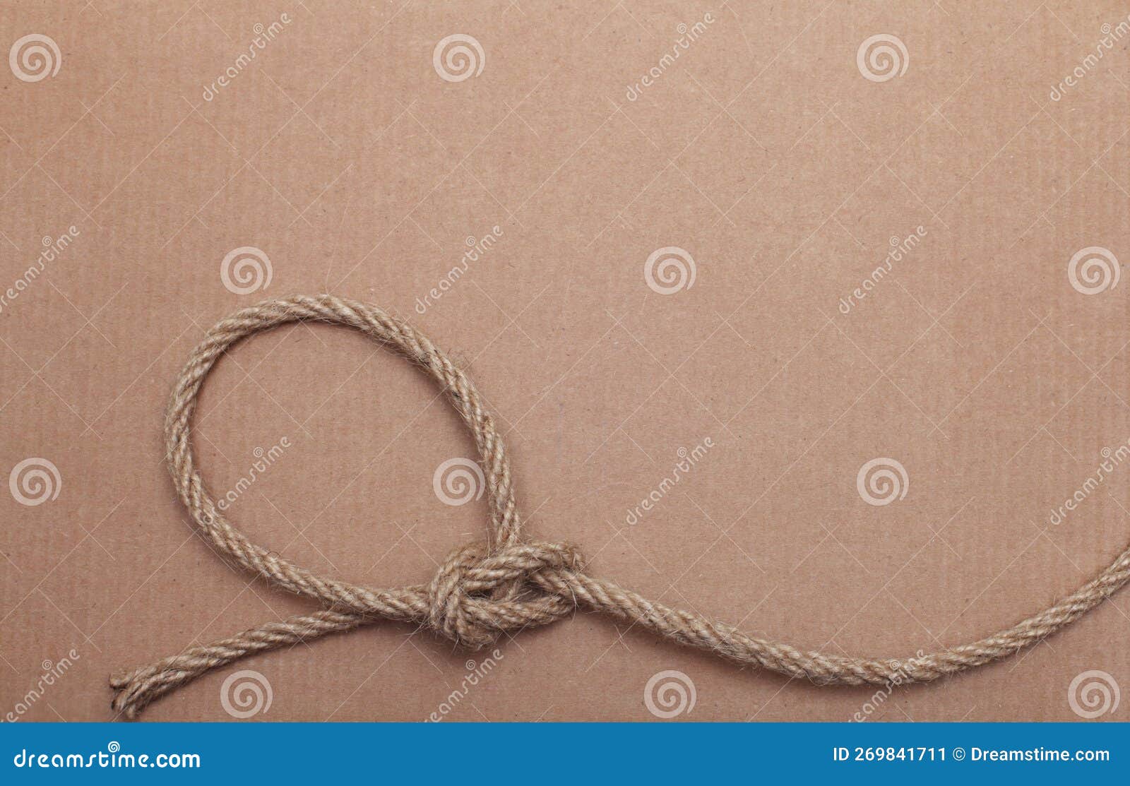 Rope Knot on Kraft Cardboard Background Stock Image - Image of isolated ...