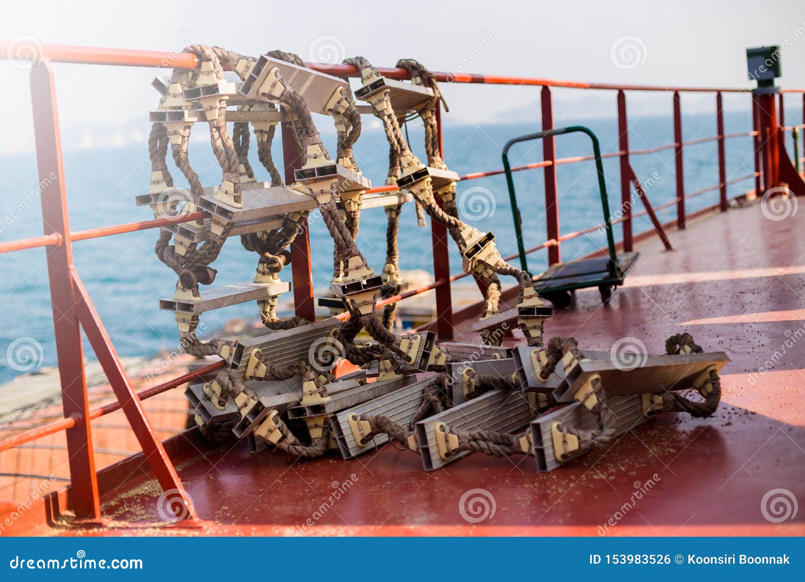 Rope ladder on cargo ship. stock photo. Image of isolated - 153983526