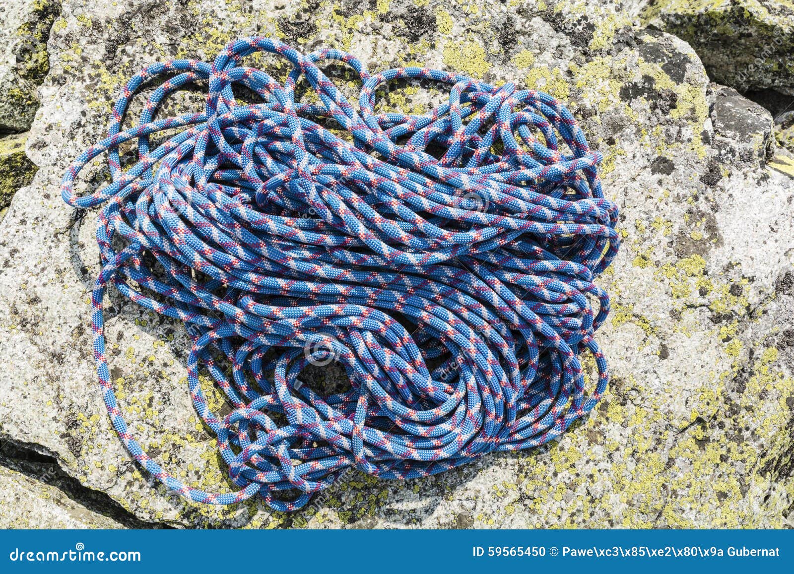 Rope on a rock stock photo. Image of equipment, blue - 59565450