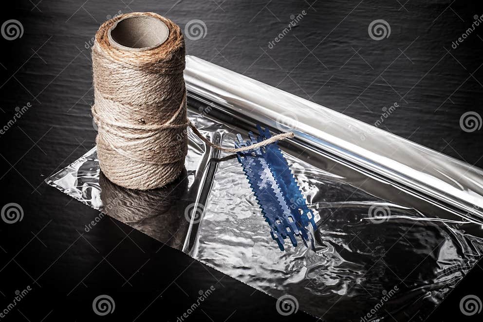 Rope and Set for Roasting Meat on a Black Background. Toned Stock Image ...