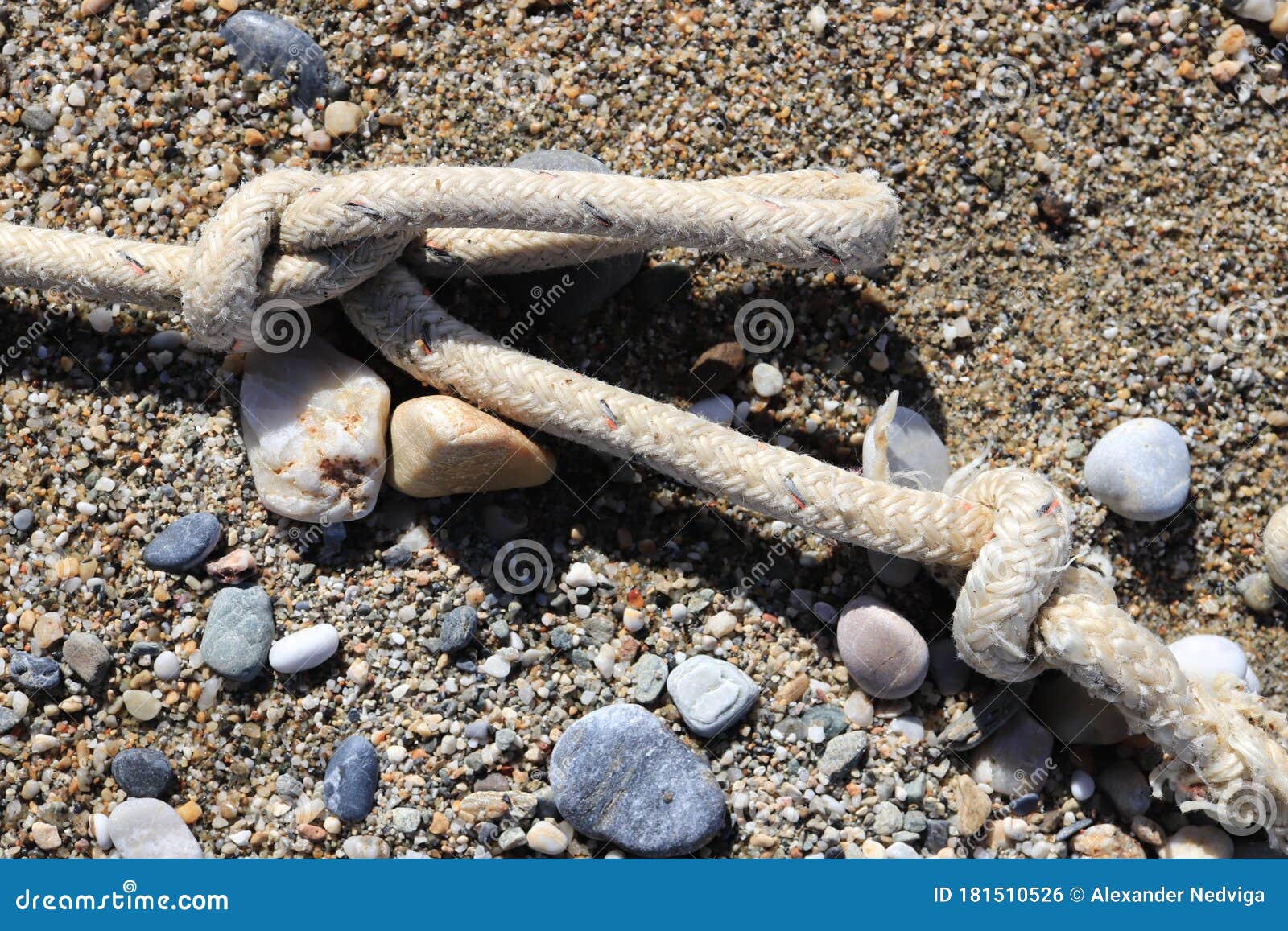 Rope with stone on sand stock photo. Image of rope, outdoor - 181510526