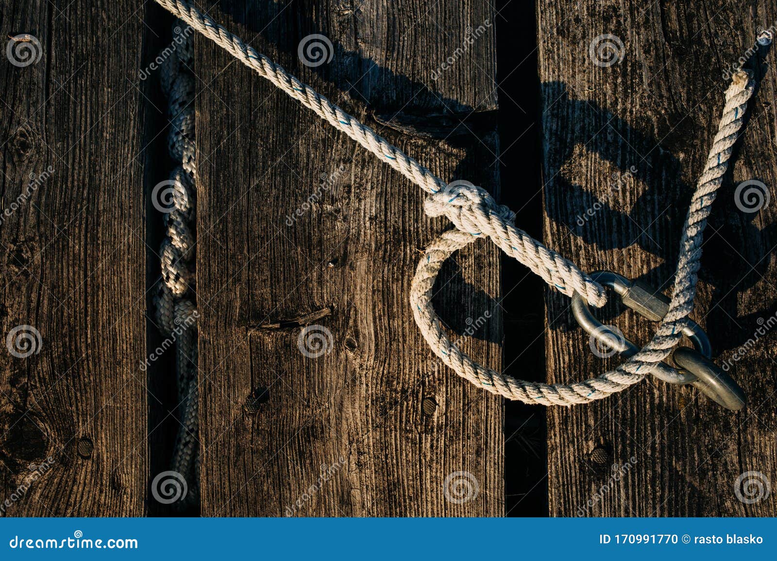 Solid Knot On Steel Rope. Iron Twisted Rope Fixed In Block By Screws ...