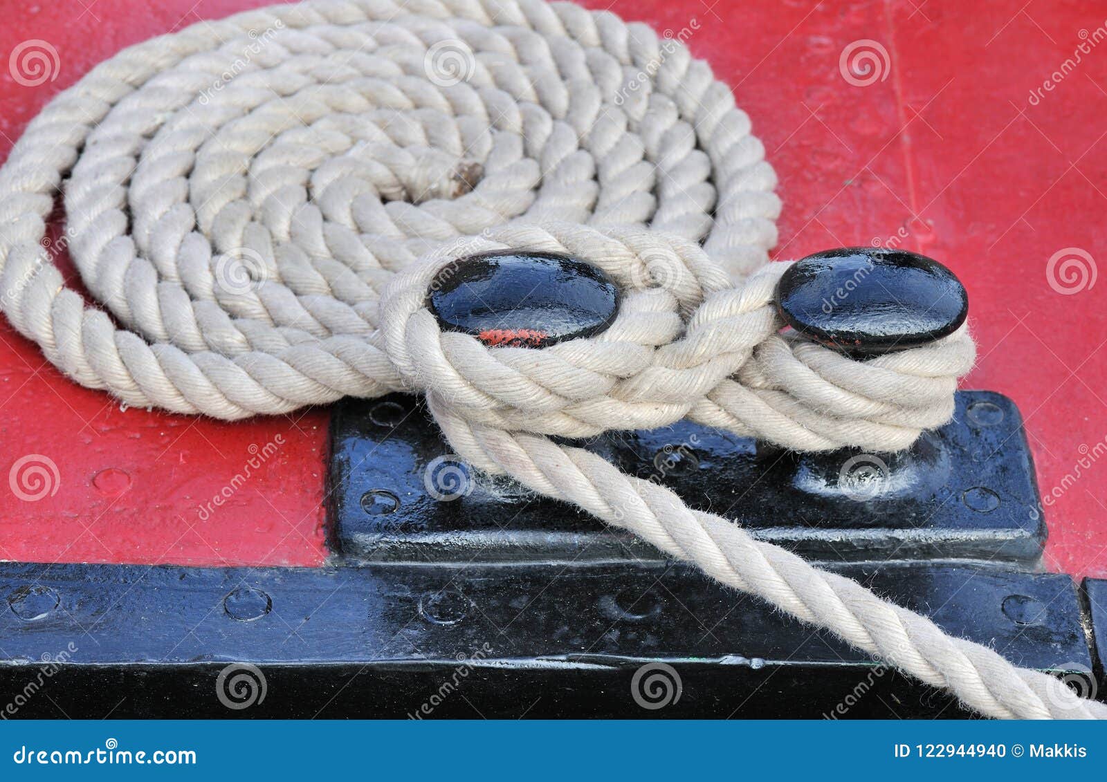 Rope tied to iron bollard stock photo. Image of colorful - 122944940