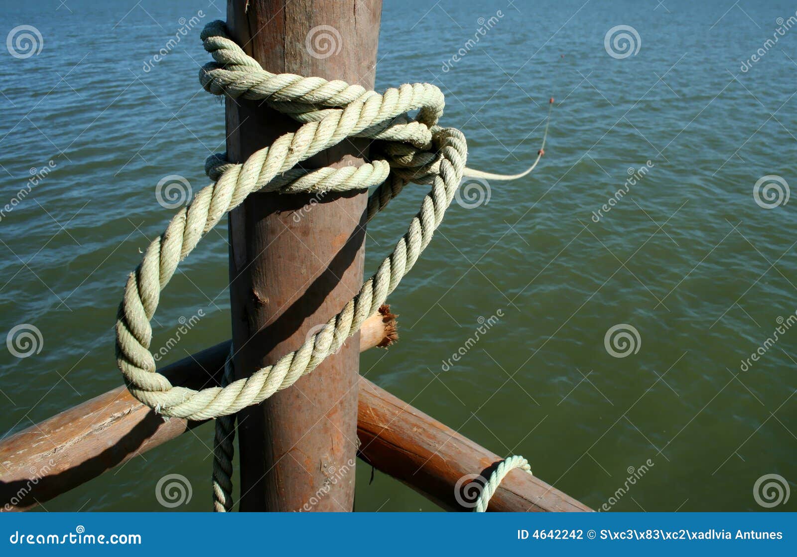 Rope tied to a marine pole stock photo. Image of thread - 4642242
