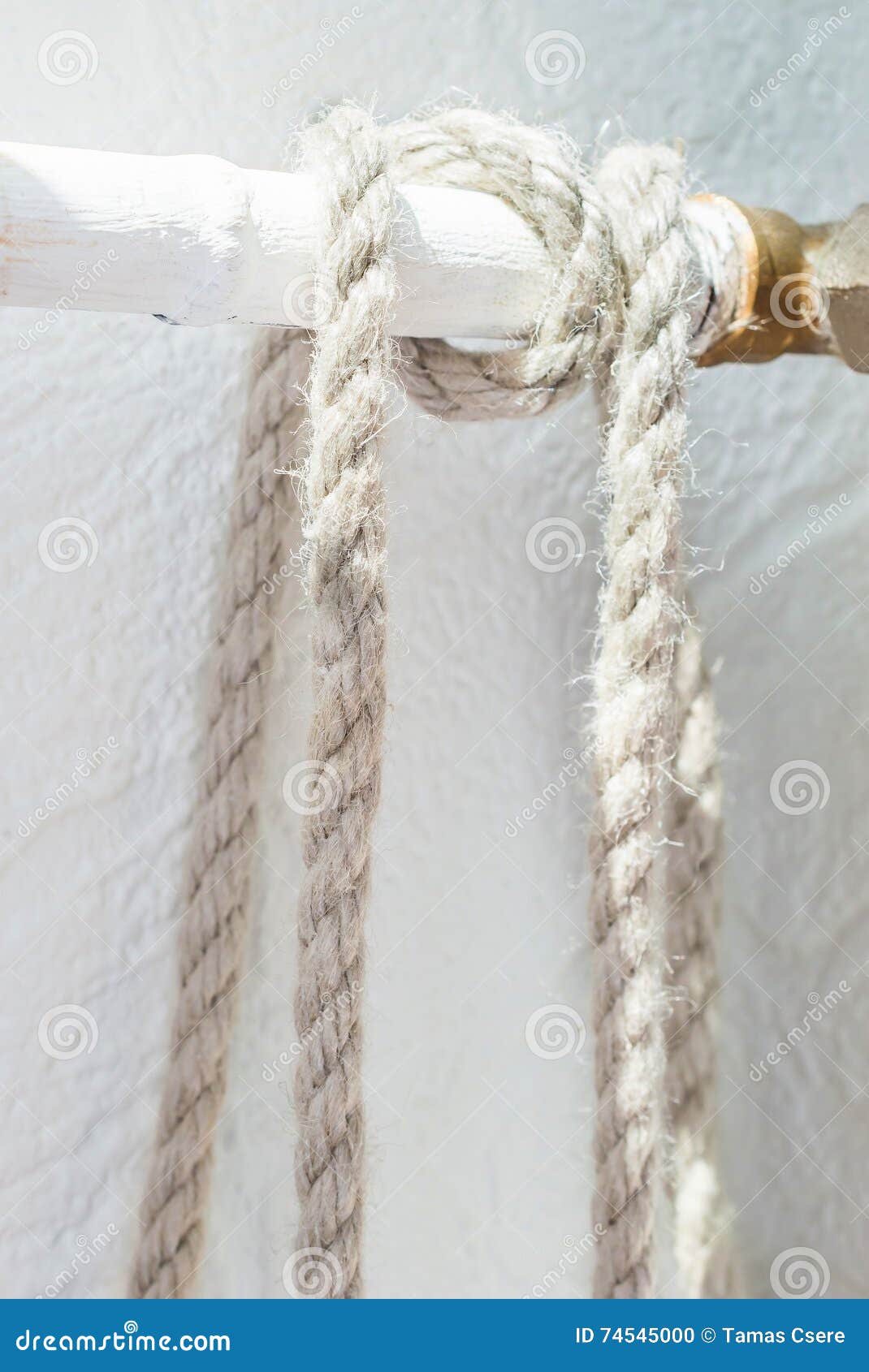 Rope tied to the pipe stock photo. Image of wall, design - 74545000