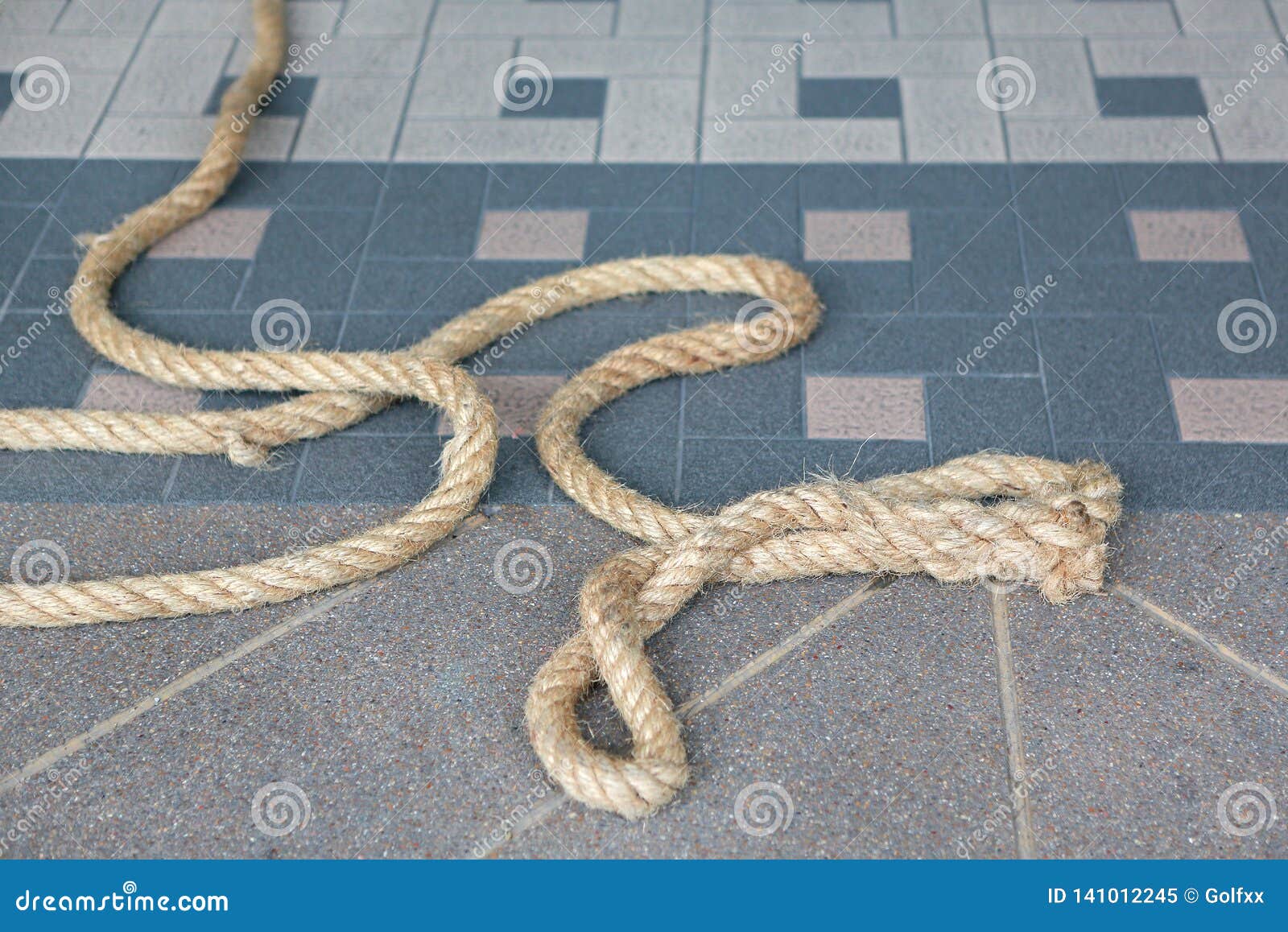A Rope on tile floor stock image. Image of decorative - 141012245