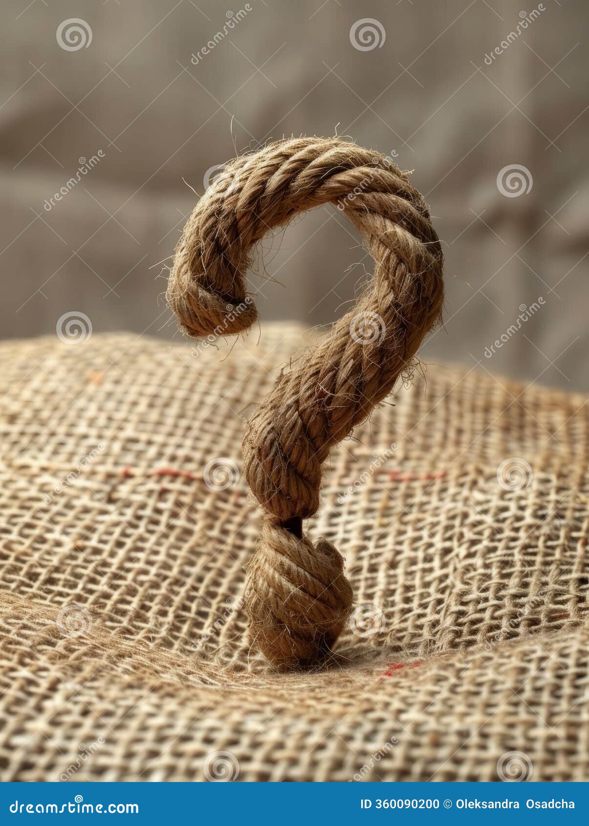 A Rope Twisted into a Question Mark Shape on Burlap Surface. Stock ...