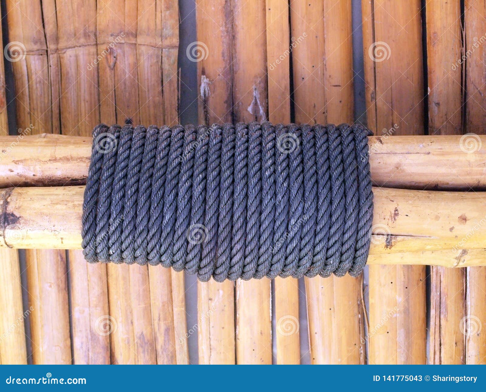 Rope wrapped around wooden stock image. Image of wood - 141775043