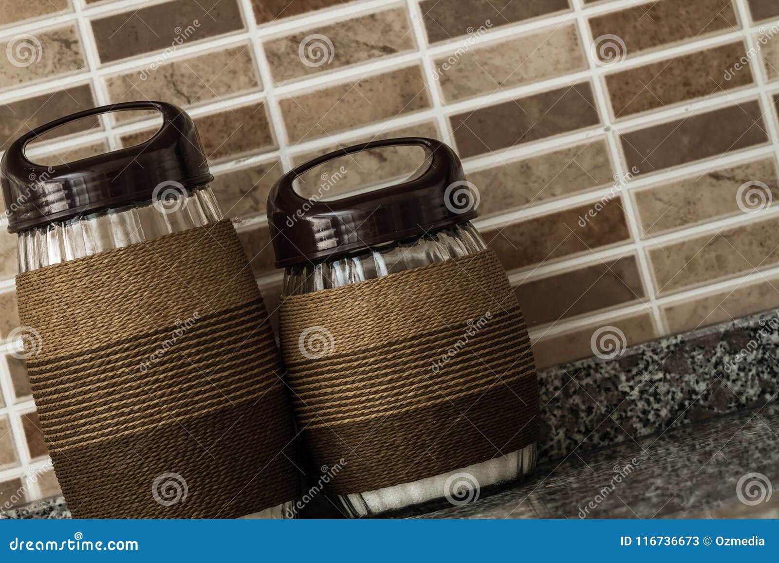 Rope Wrapped Decorative Glass Jars on Brown Background Stock Image ...