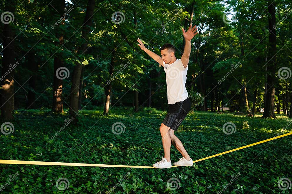 Young Man in White Tshirt Walking on the Rope Stock Image - Image of ...