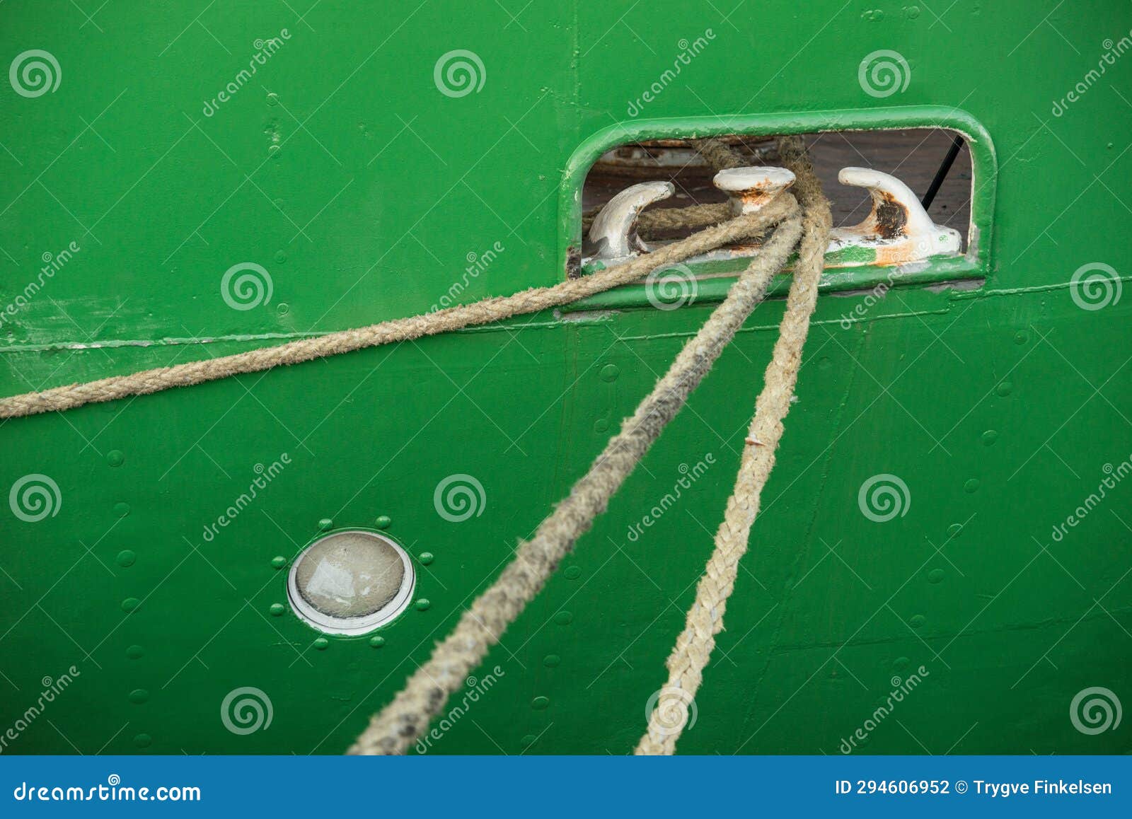 Roped Going through a Mooring Hole of a Green Metal Ship.. Stock Photo ...