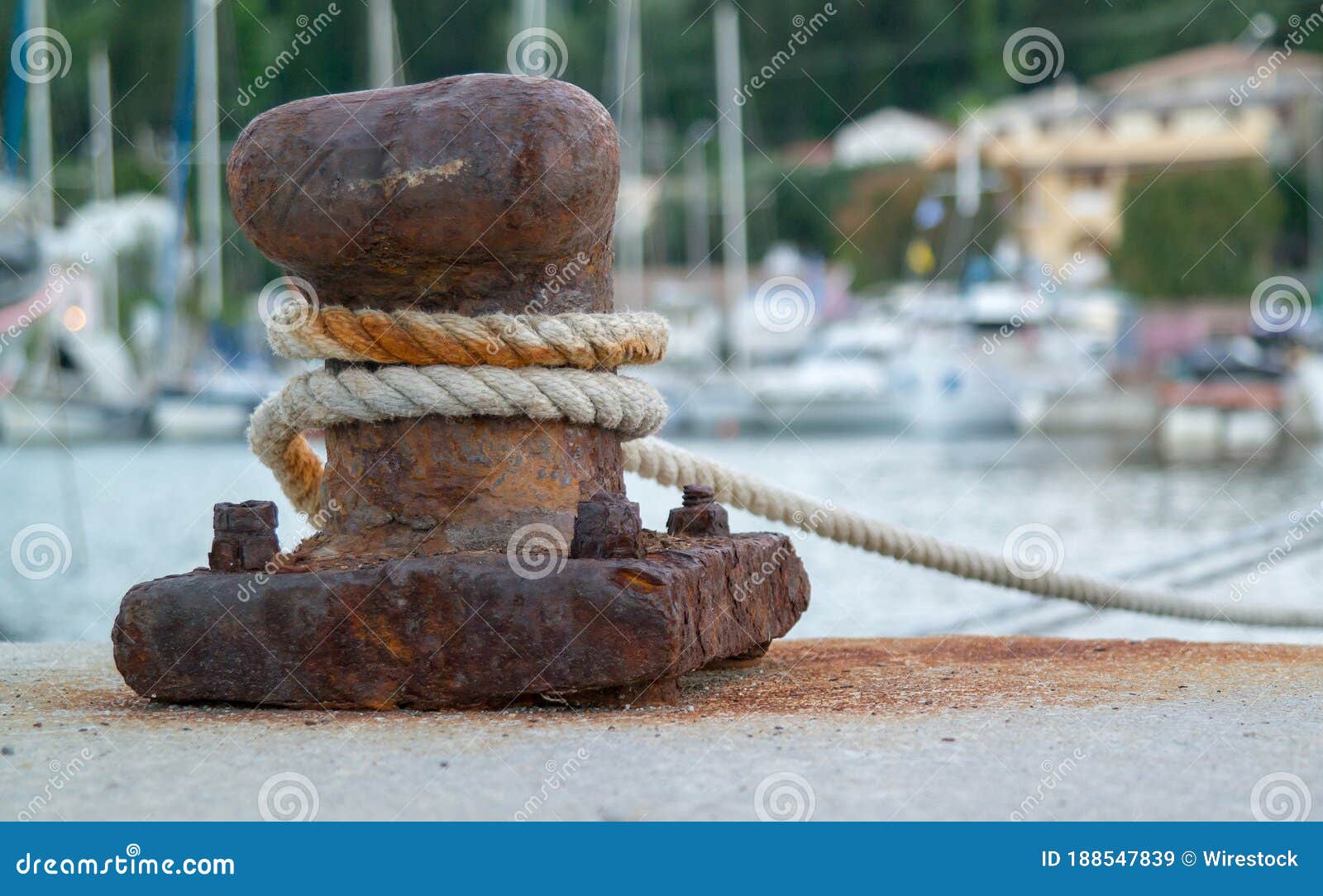 Ropes of a Ship Wrapped Around a Mooring Bollard on the Pier Stock ...