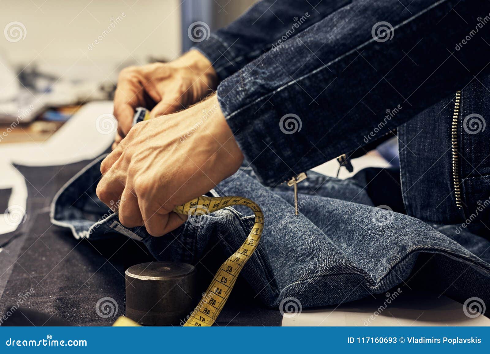Ropped Image of Tailor Makes Measurements of Jeans with a Meter at ...
