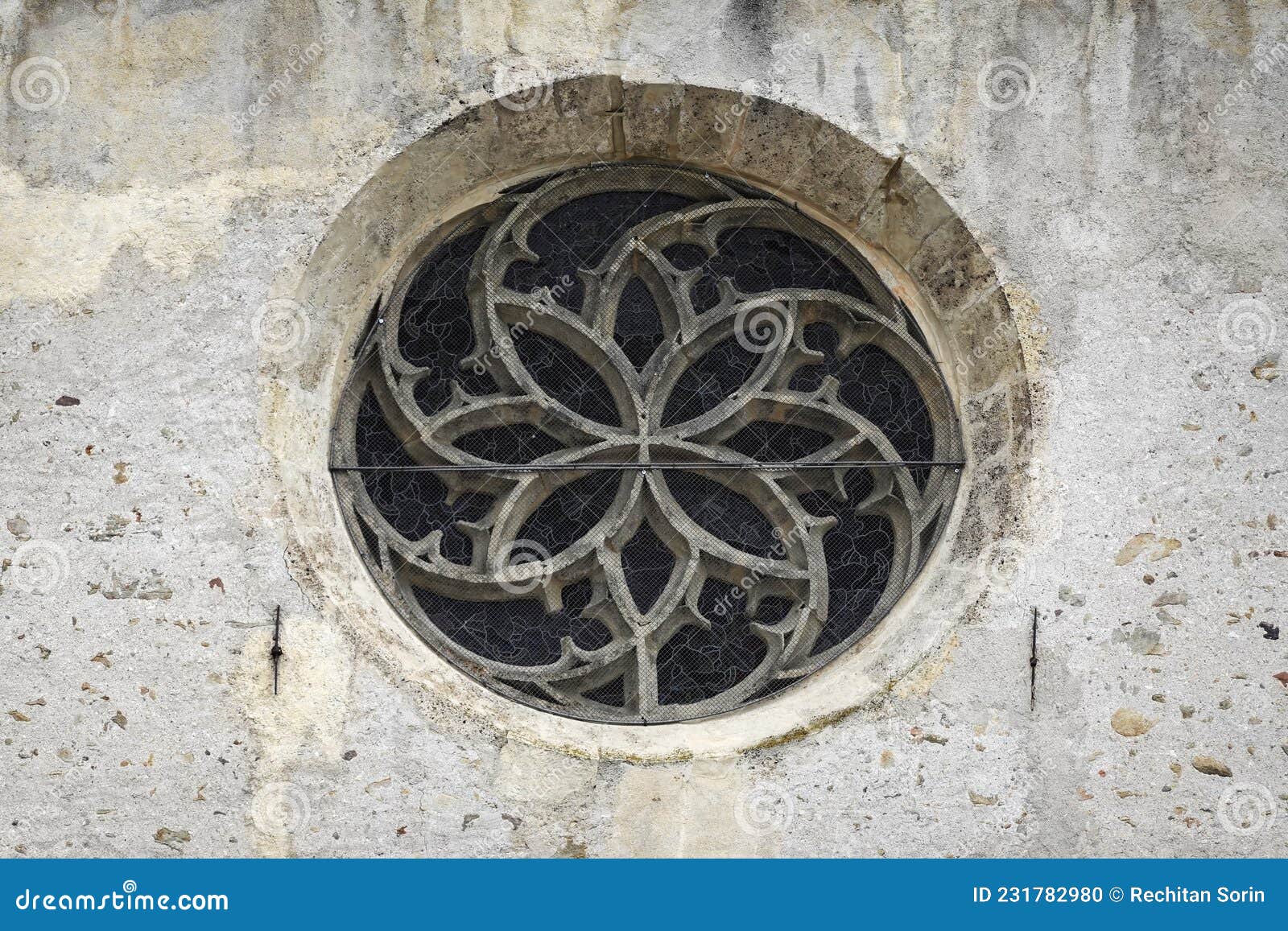 Rose Window on the Wall of Parochial Church in Fiera Di Primiero. Stock ...