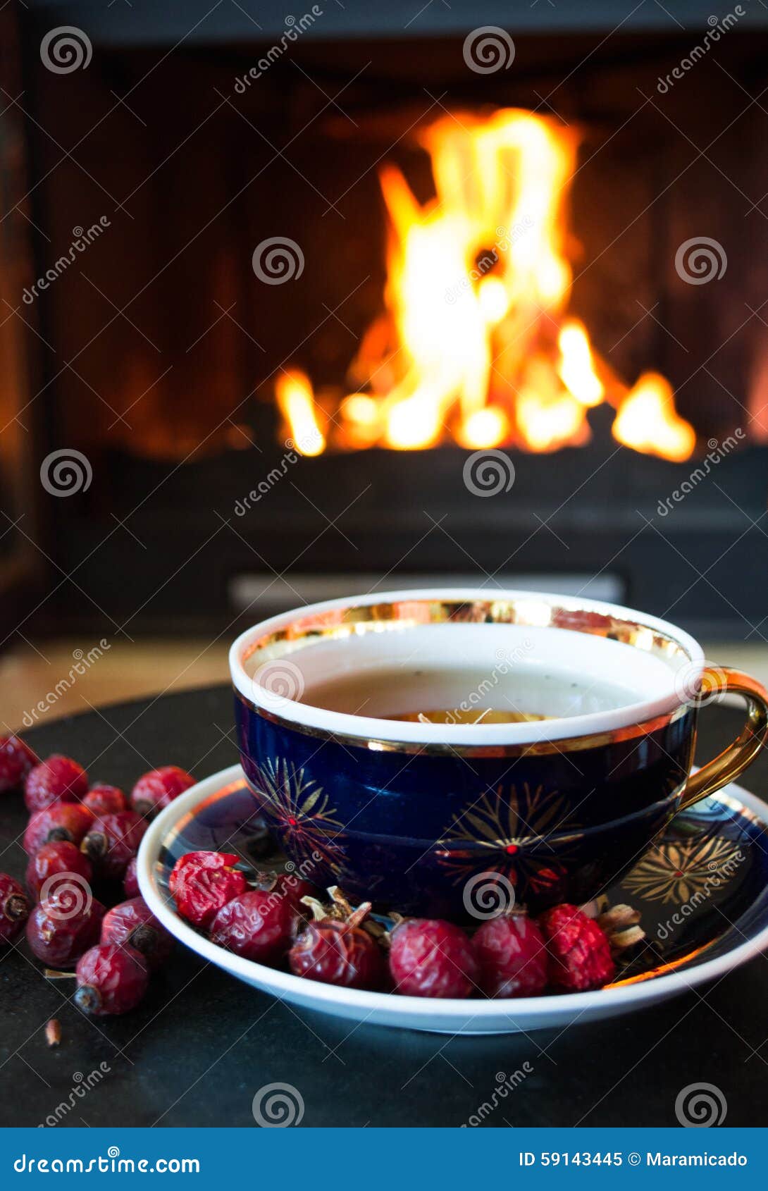 Rosehip Tea in Front of Roaring Fire in a Fire Place Stock Image ...