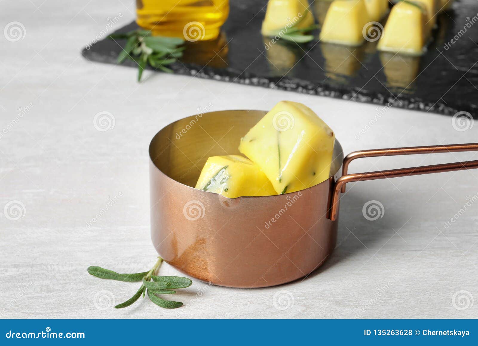 Rosemary and Olive Oil Ice Cubes in Saucepan Stock Photo - Image of ...