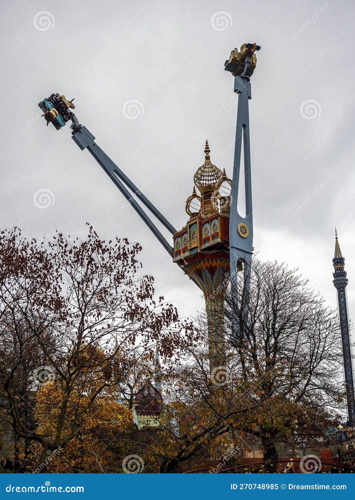 Rotating Arms of the Vertigo Ride Emerge from the Tree Lines Editorial ...