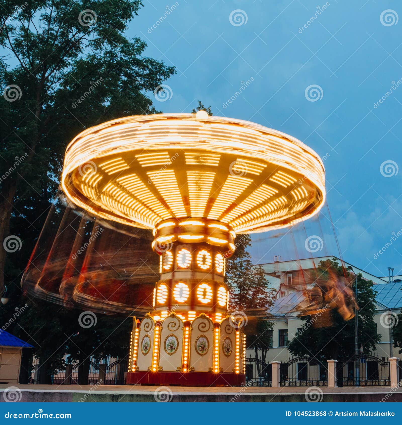 A Working Carousel in the Evening Hours in the Park Stock Photo - Image ...