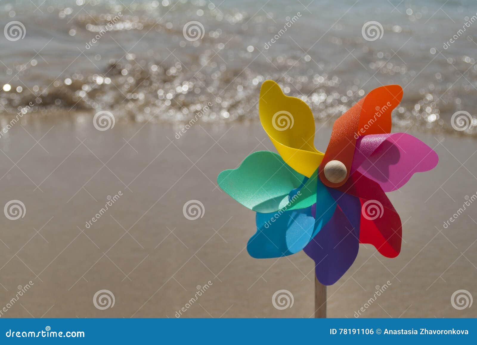Rotating Colorful Rainbow Pinwheel on the Beach Stock Photo - Image of ...