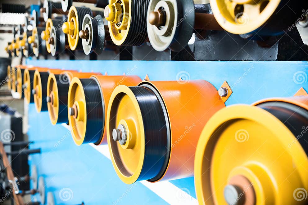 Rotating Rubberized Wheels of the Winding Machine. Stock Image - Image ...