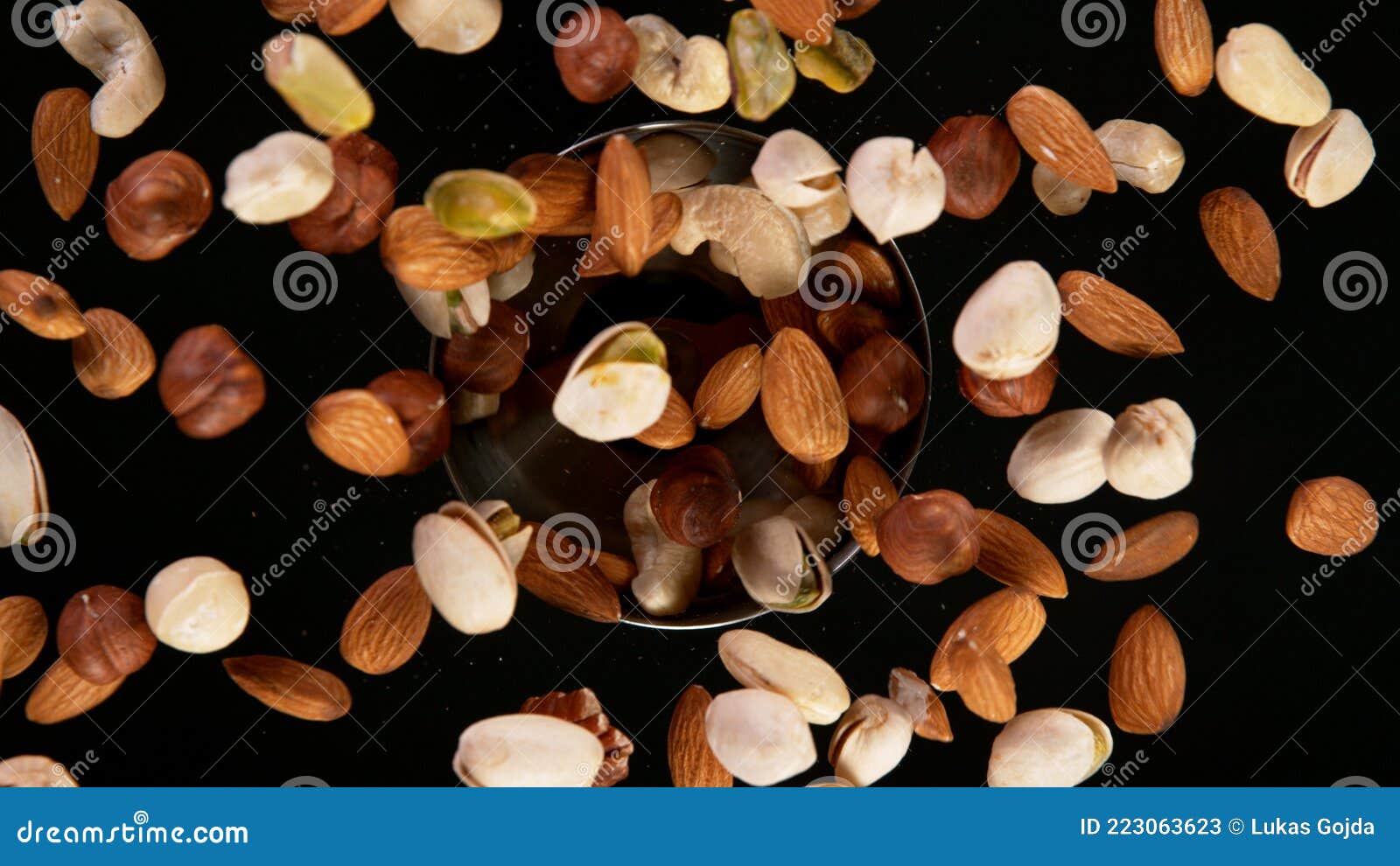 Rotating Various Nuts on Black Background. Stock Image - Image of ...