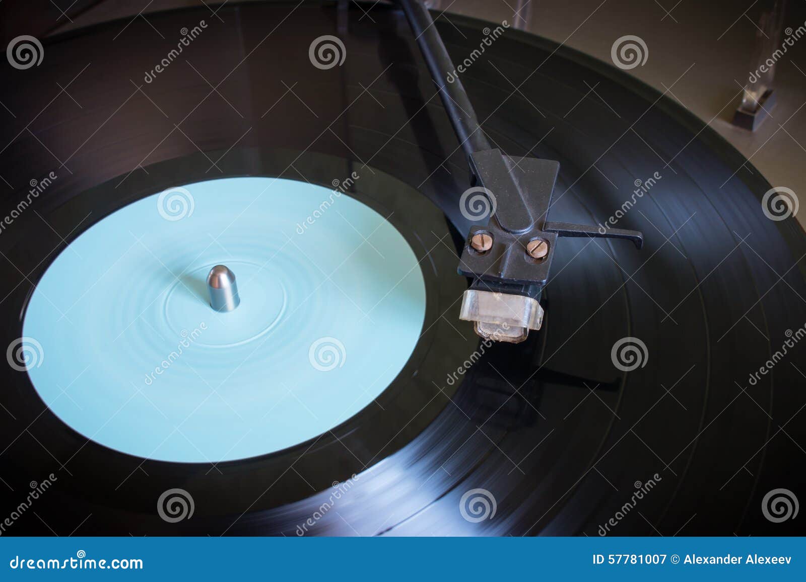 Rotating Vinyl Record with Blue Label on a Turntable Close-up Stock ...