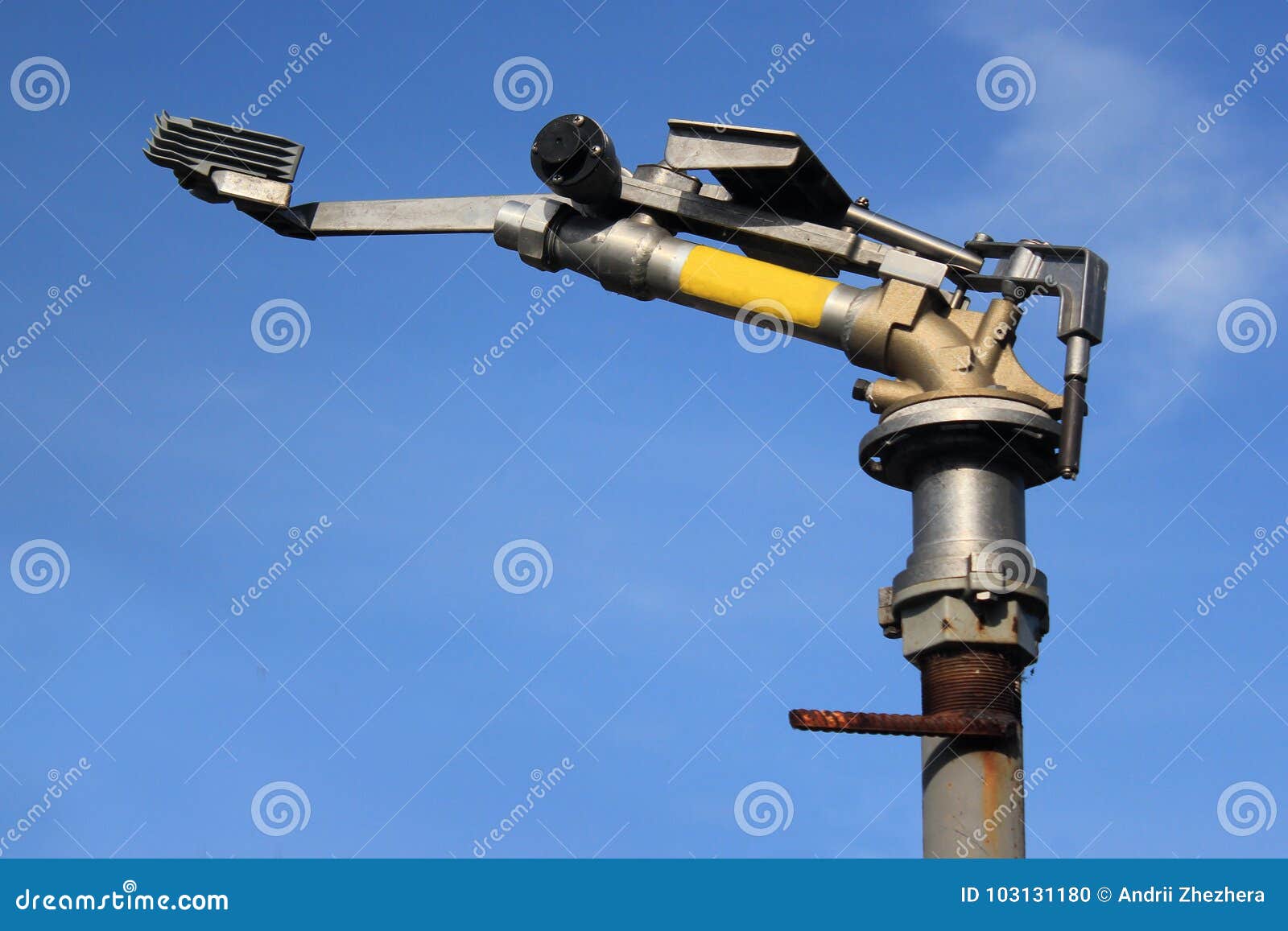 Rotating Water Spraying Cannon Against Blue Sky Background Stock Photo ...
