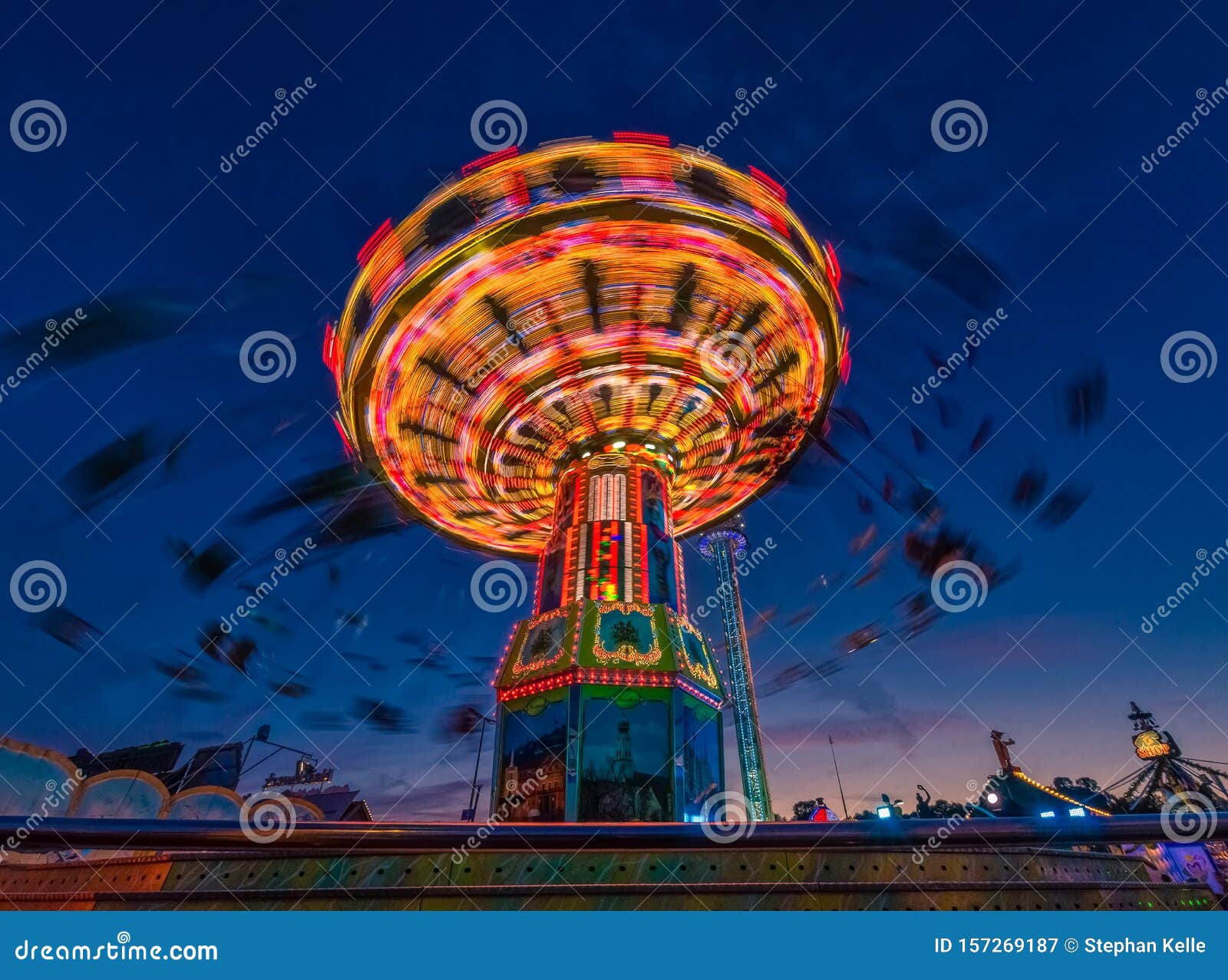 A Rotation Chain Carousel Illuminated With Different Bright Colors ...