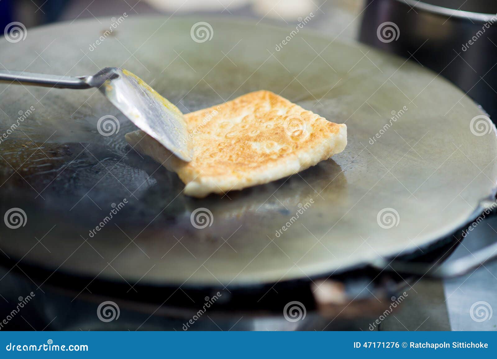 Roti while frying on pan stock photo. Image of oily, diabetes - 47171276