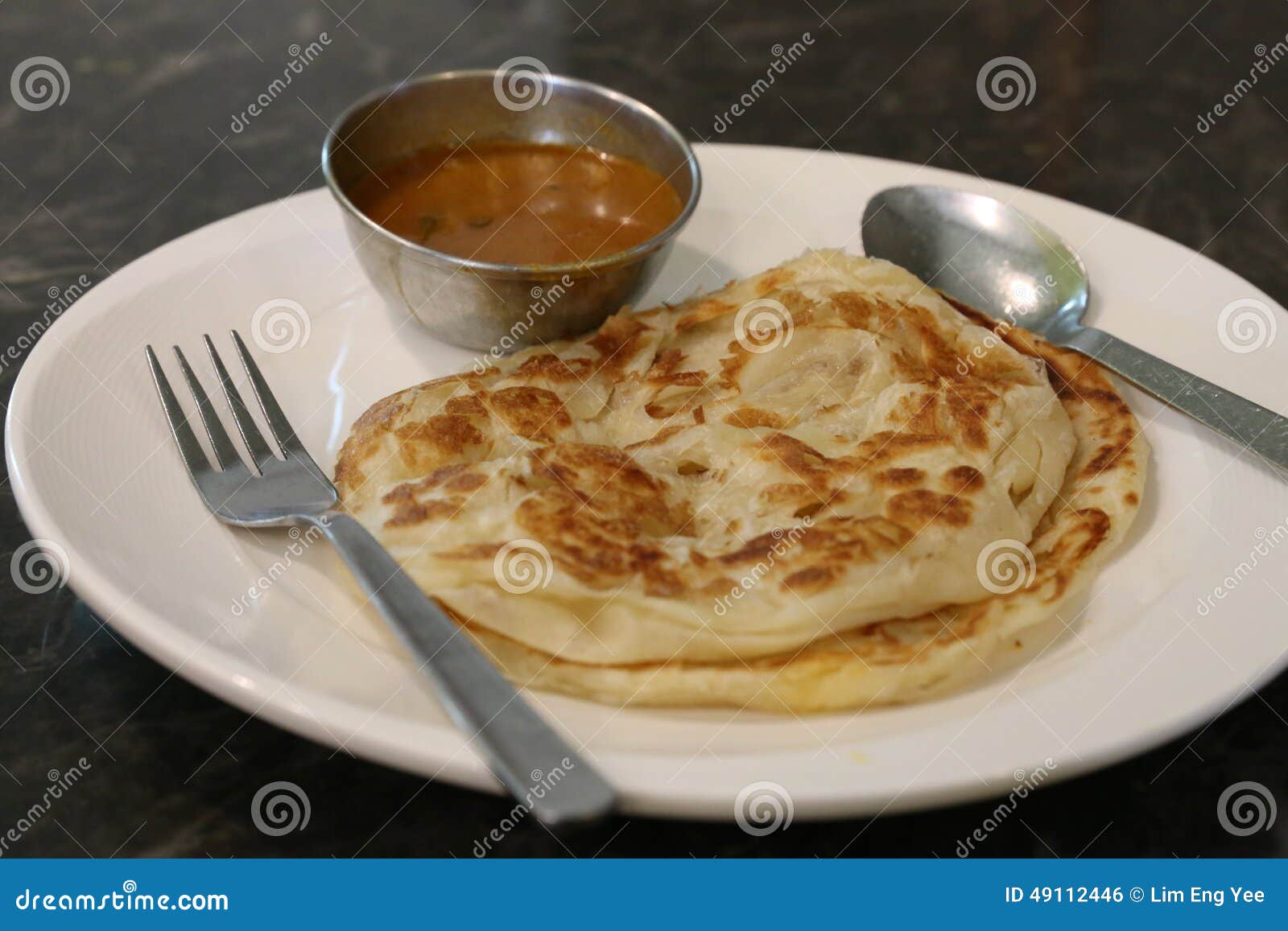 Roti Prata Or Roti Canai, A Traditional Indian Bread Served With Curry ...