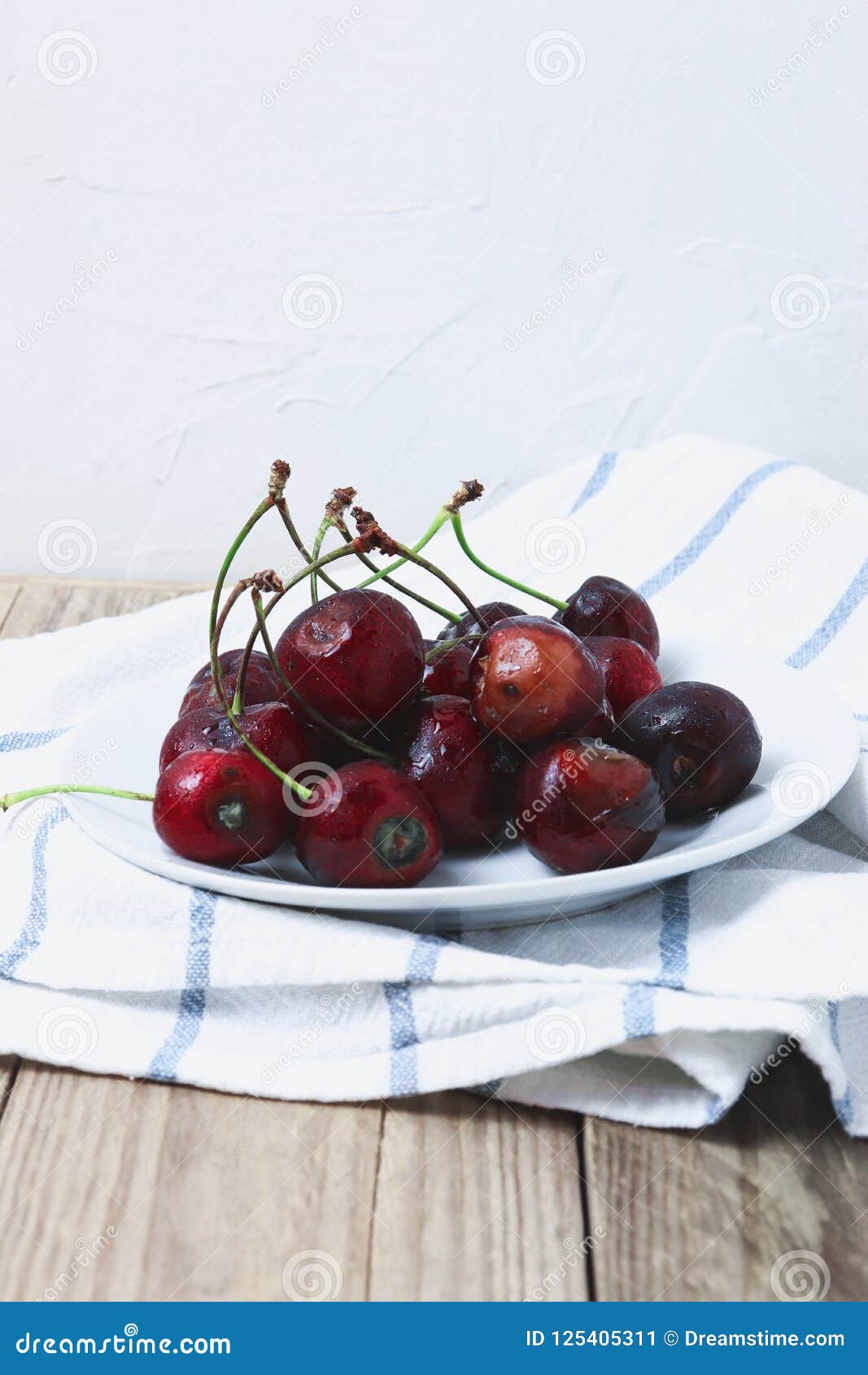 Rotten cherries on a plate stock image. Image of cherry - 125405311