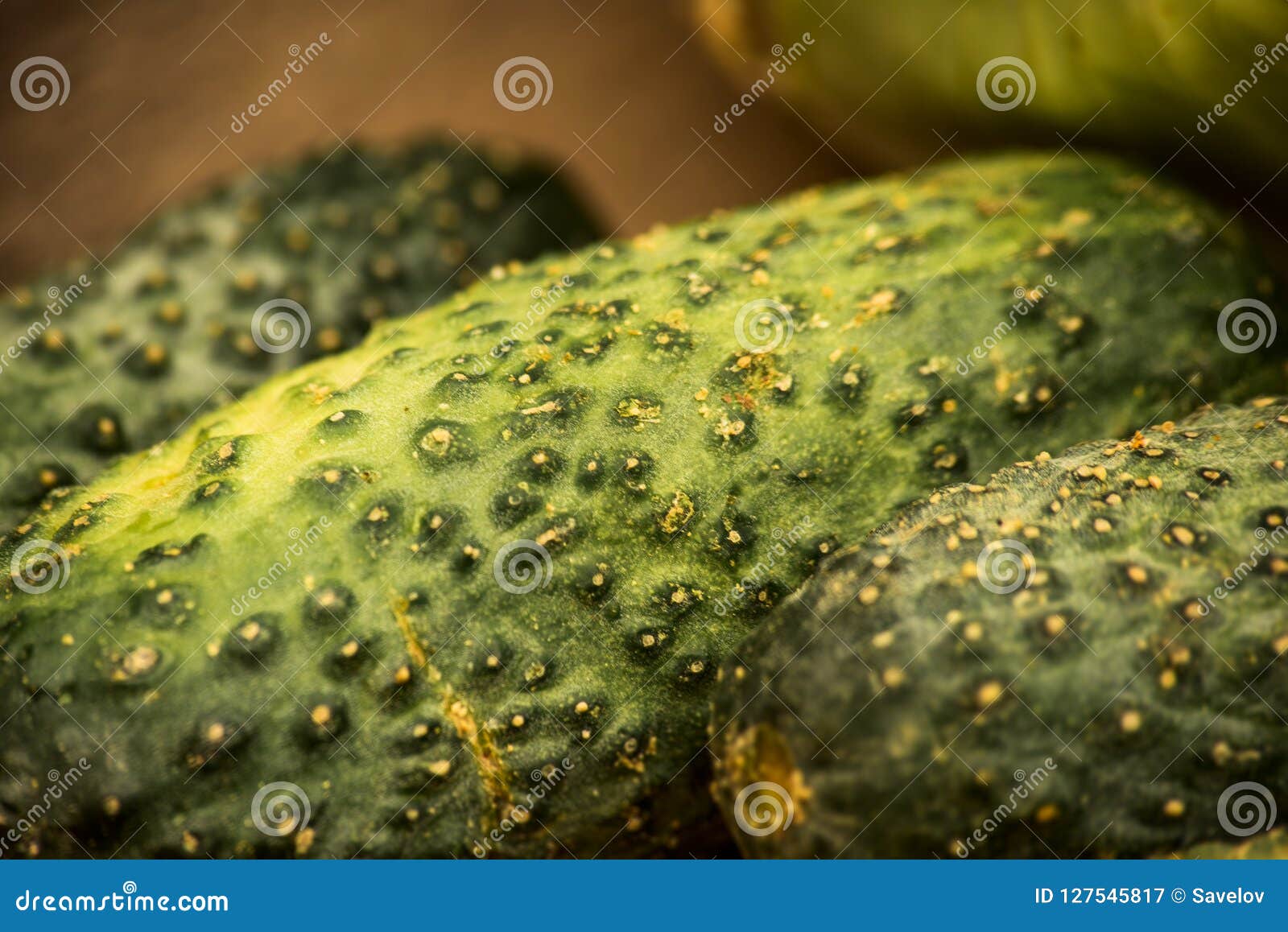 Rotten Cucumbers On Yellow Background. Excessive Consumption Concept ...