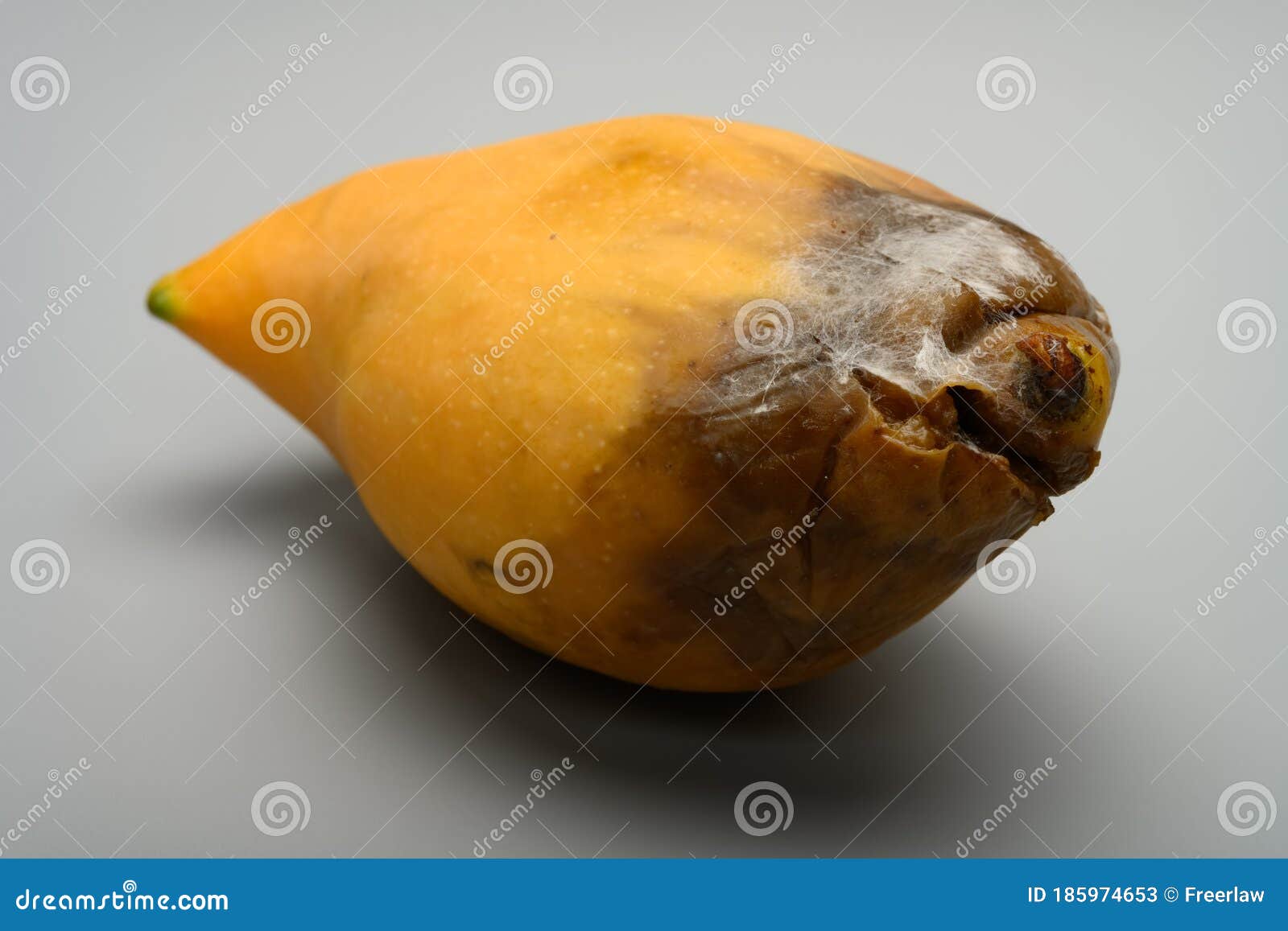 Rotten Mango On Wood Background Stock Image | CartoonDealer.com #54889393