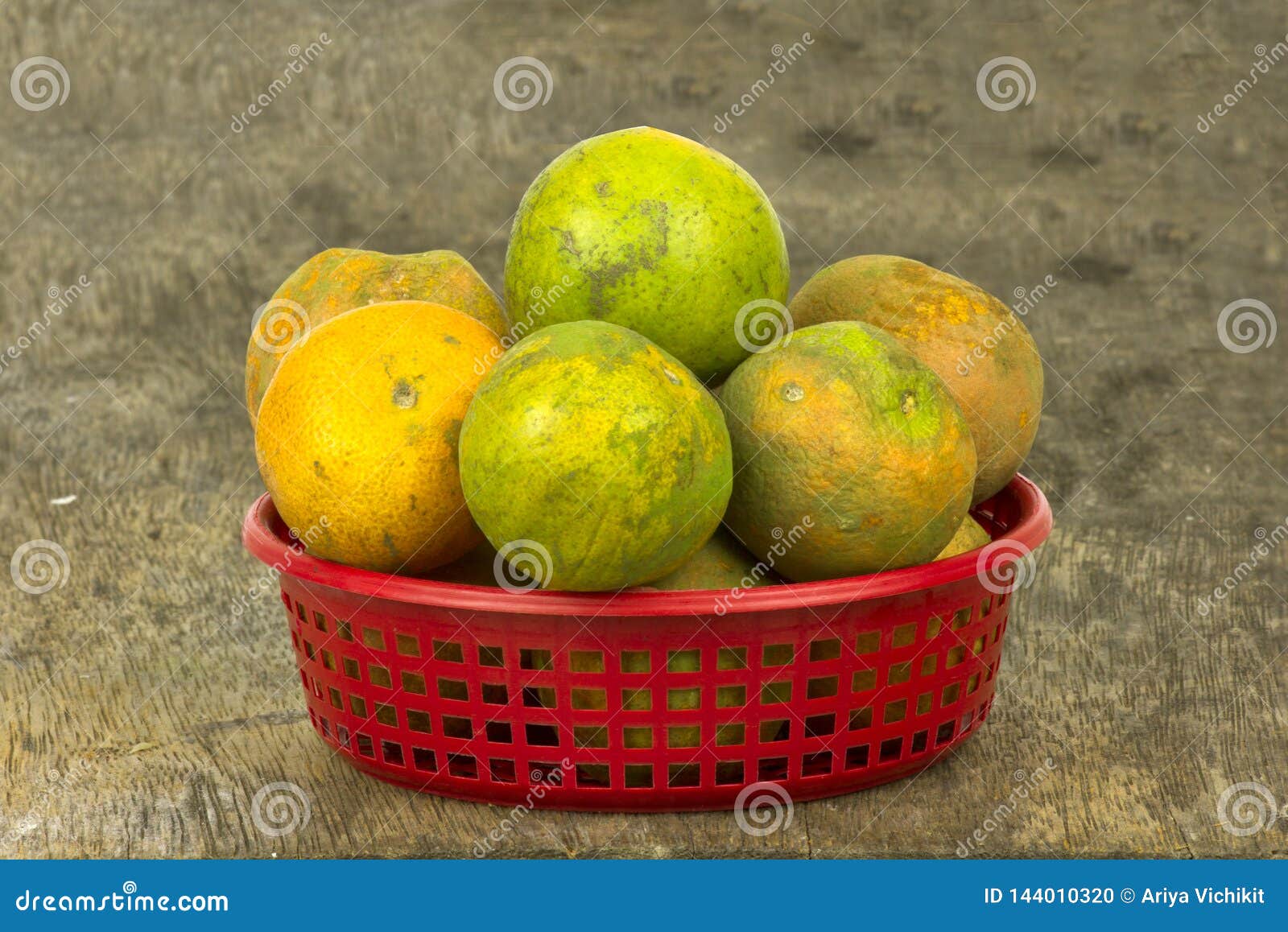 Rotten Orange in a Plastic Basket on Wooden Floor Stock Photo - Image ...