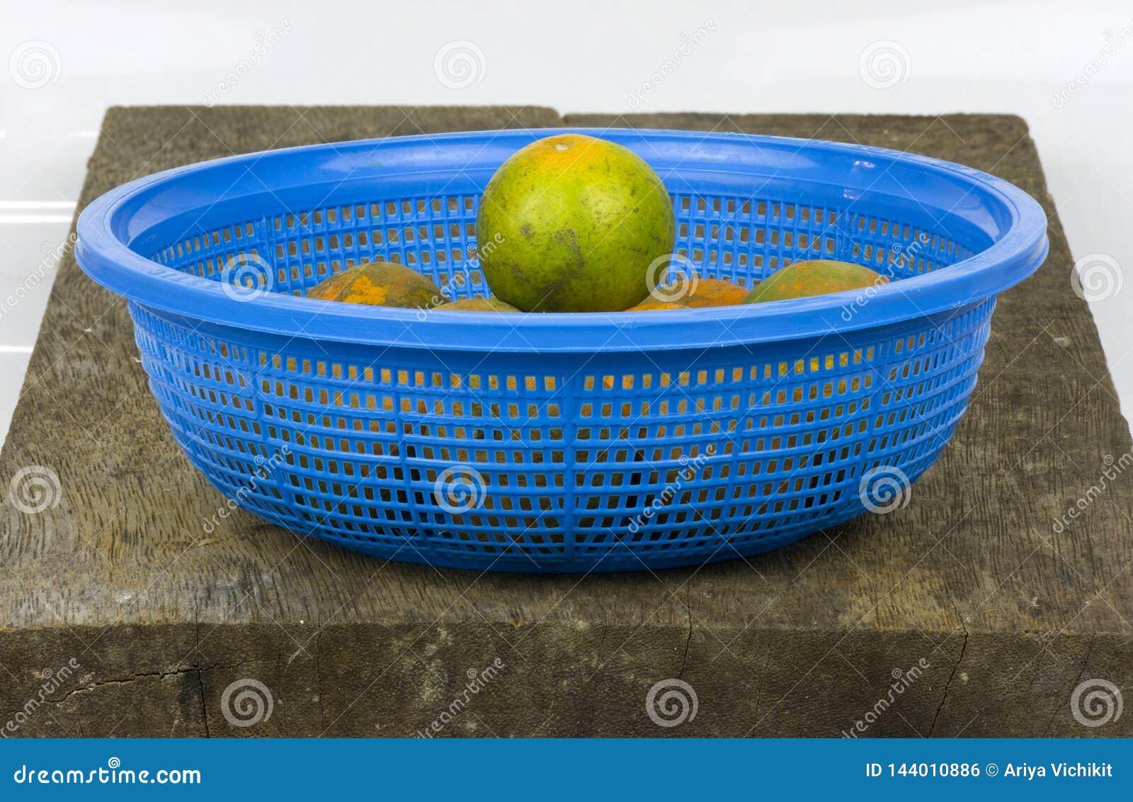 Rotten Orange in a Plastic Basket on Wooden Floor Stock Photo - Image ...