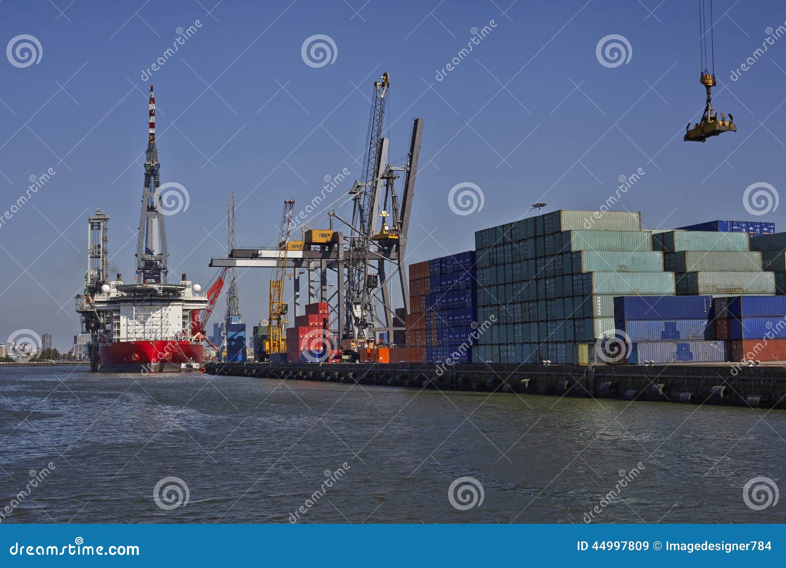 Rotterdam. Large Harbor Crane Lifting a Sea Container Stock Image ...