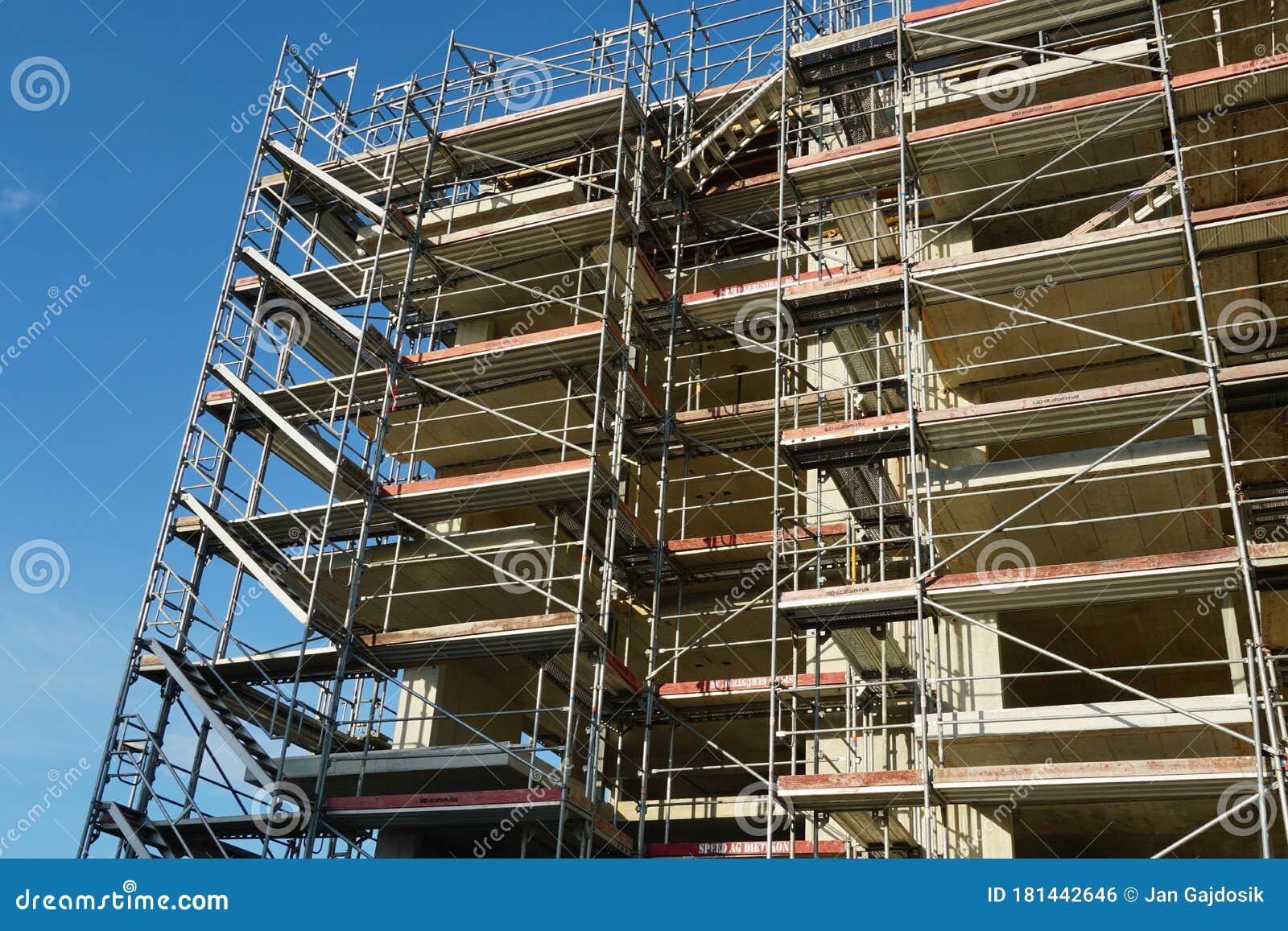 Rough Construction of a New Residential Building Covered by Scaffolding ...