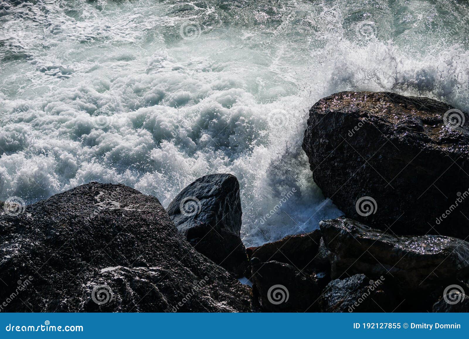Rough Foamy Waves Break on the Black Coastal Rocks Stock Image - Image ...