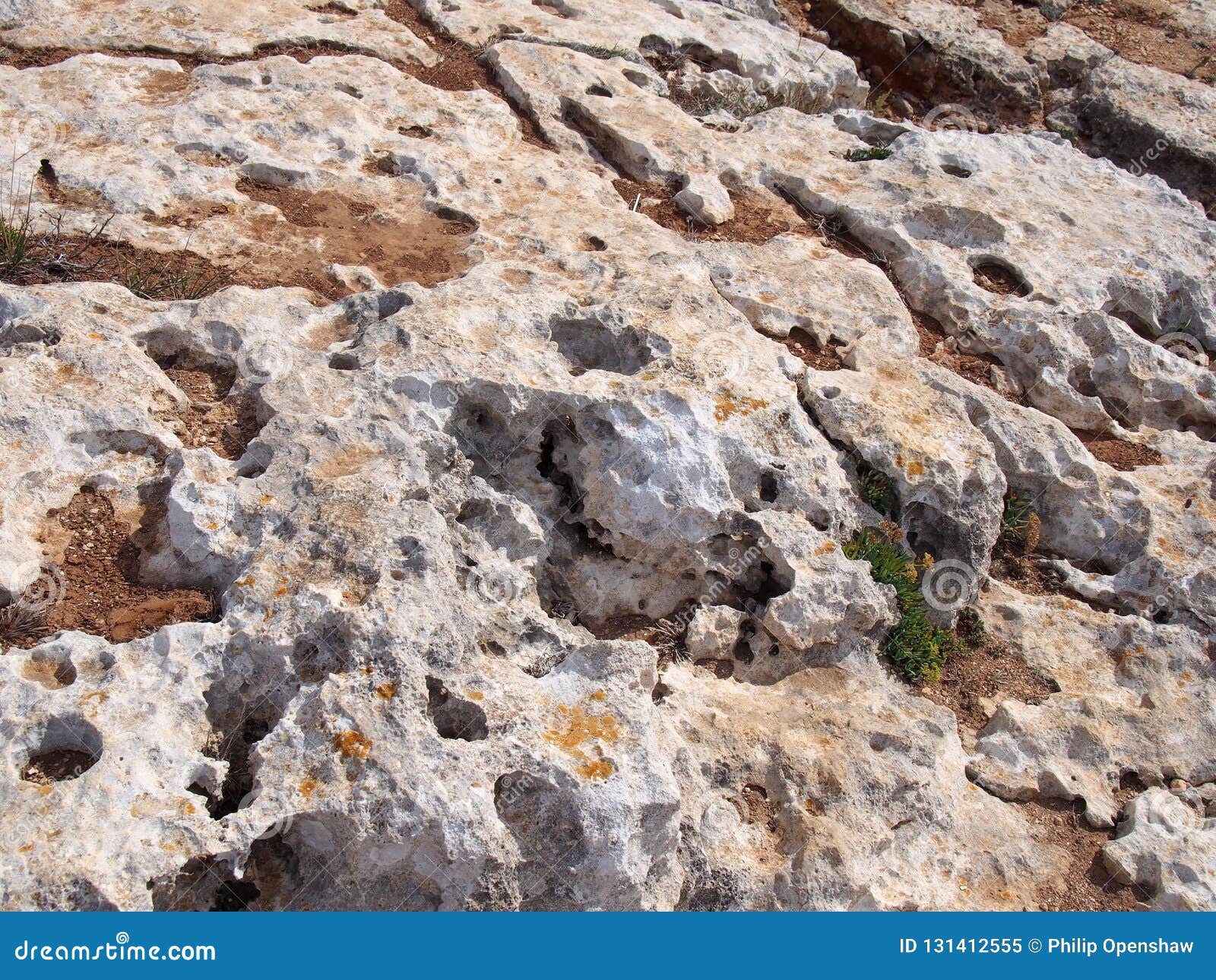 Rough Grey Eroded Limestone Ground on a Beach with Scattered Sand Stock ...