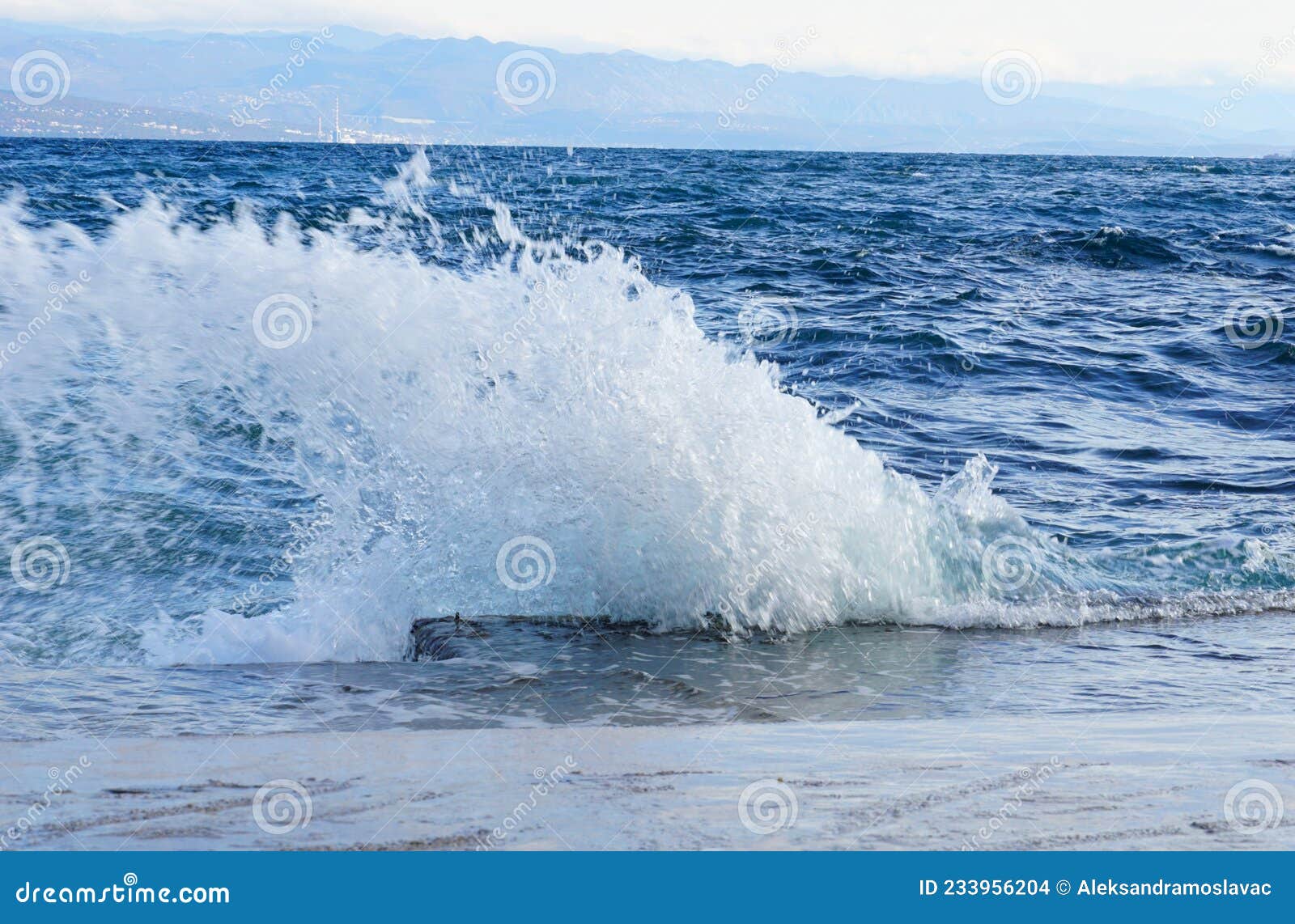 A Rough Sea Surface and a Wave Lapping the Shore Stock Photo - Image of ...