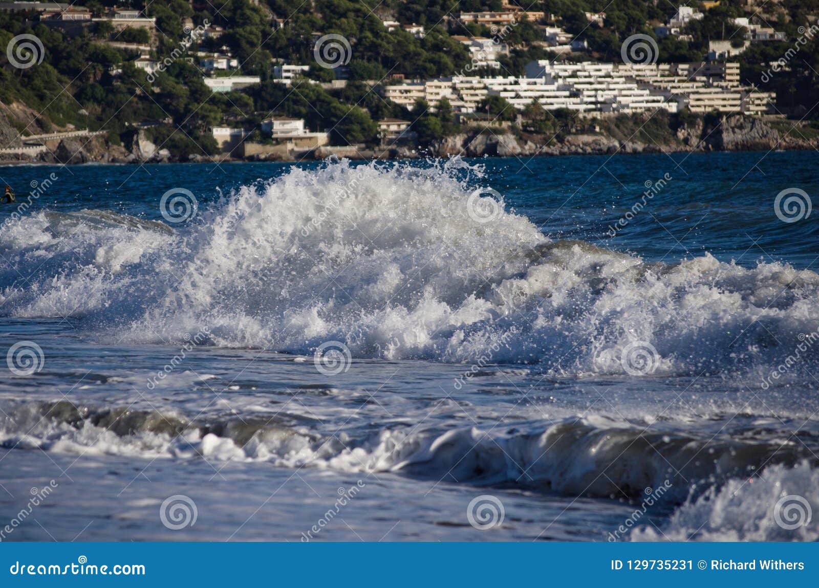 Rough waves Spanish beach stock image. Image of waves - 129735231