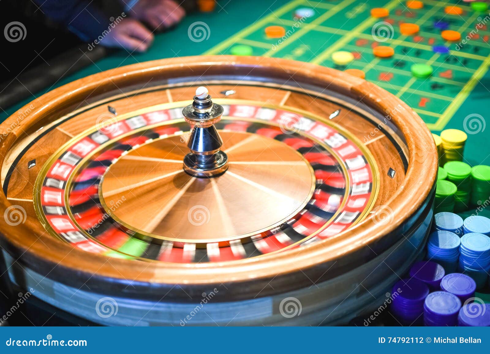 Roulette in Motion. Green Table with Colored Chips Ready To Play. Stock ...