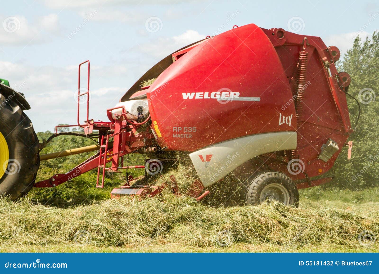 A Round Baler Making Hay Bale Bales during Harvesting Editorial ...