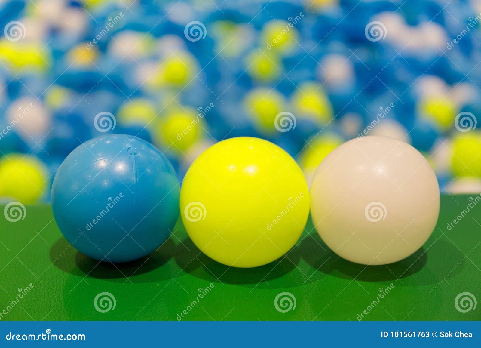 3 Balls of Blue, Yellow and White at Children`s Ball Pit Stock Image ...
