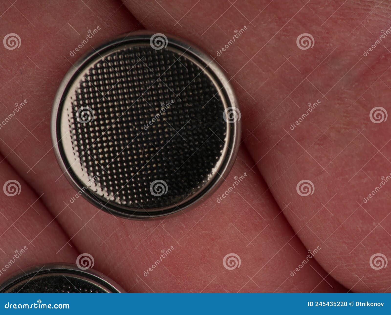 Round Battery in Hand. Closeup Stock Photo - Image of cell, shiny ...